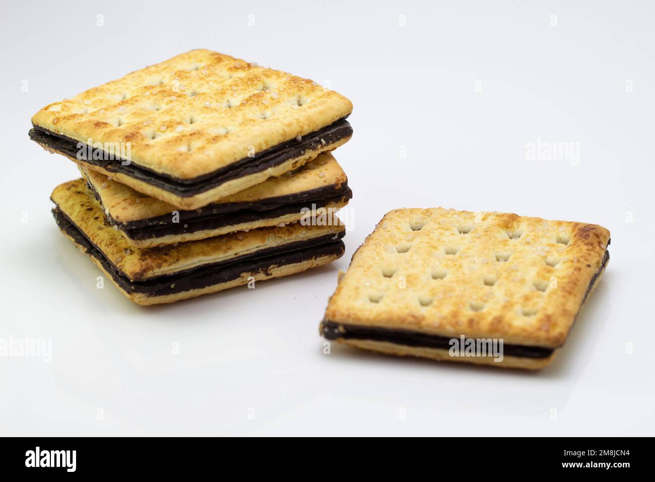 Chocolate coated biscuits isolated on white Stock Photo - Alamy