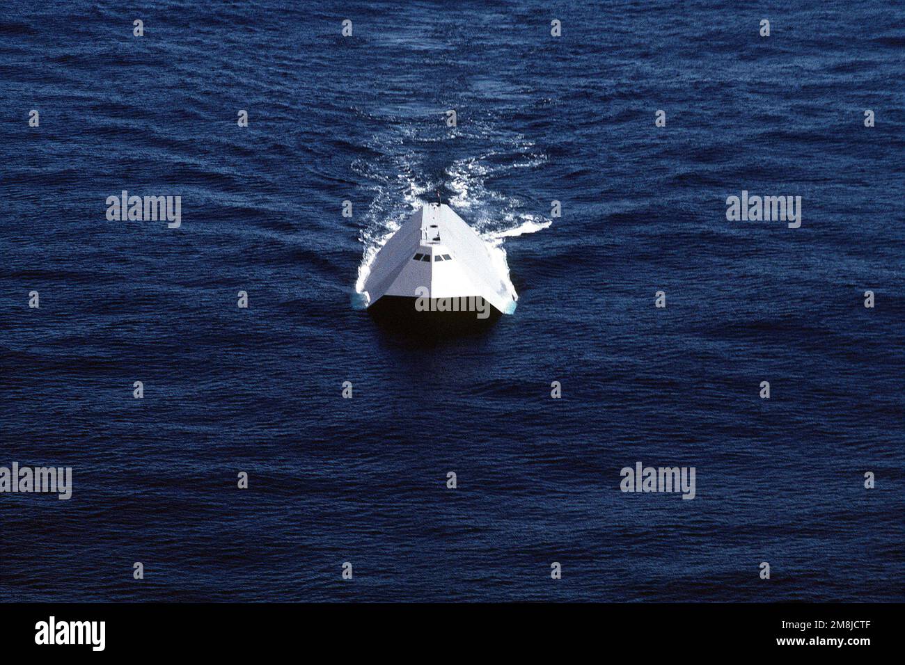 An aerial bow view of the experimental stealth ship SEA SHADOW ...