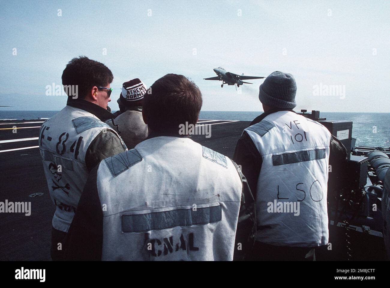 An F-14 Tomcat aircraft of Fighter Squadron Eighty-Four (VF-84) passes ...