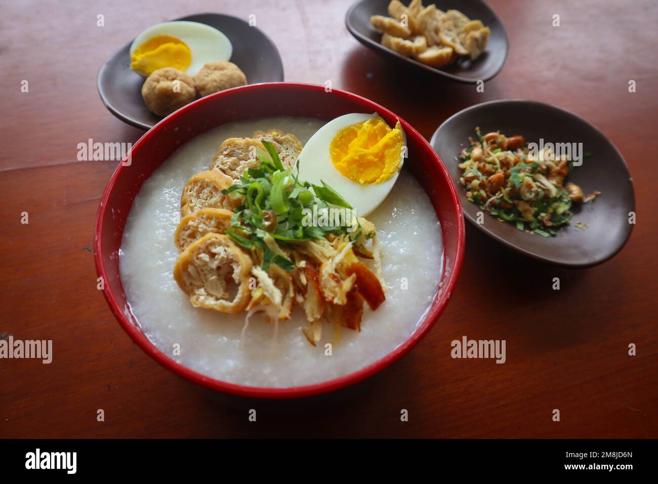 congee porridge with chicken slice, tofu, egg. congee porridge from ...