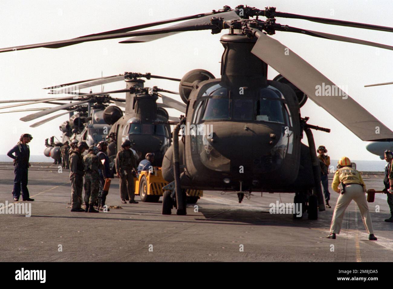 Flight deck personnel do final preflight checks on a U.S. Army MH-47D ...