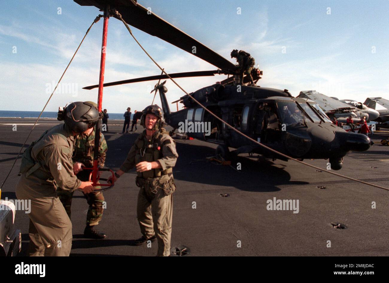 Crewmembers of a U.S. Army MH-60 Black Hawk (Blackhawk) command and ...