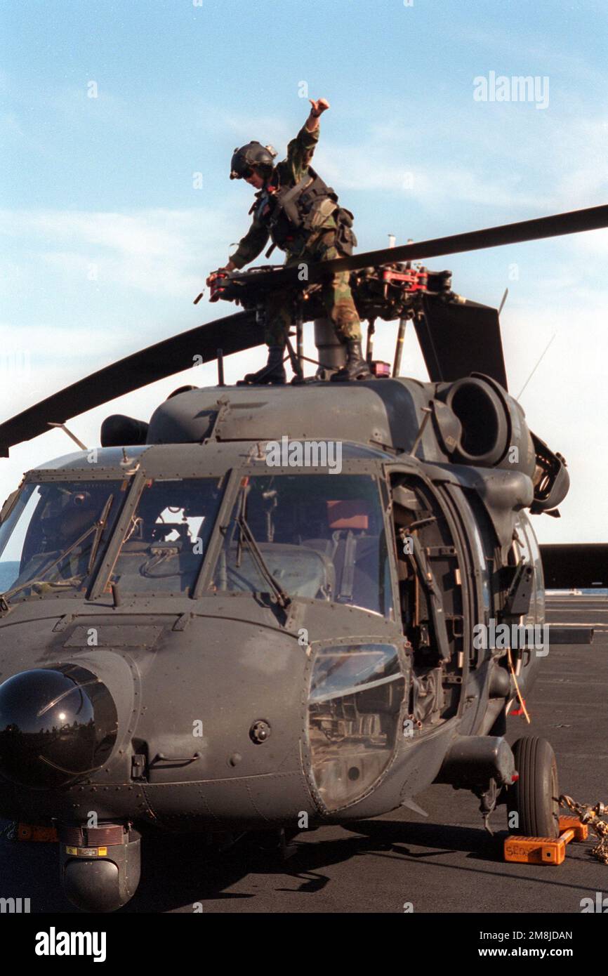 Crewmembers of a U.S. Army MH-60 Black Hawk (Blackhawk) command and ...