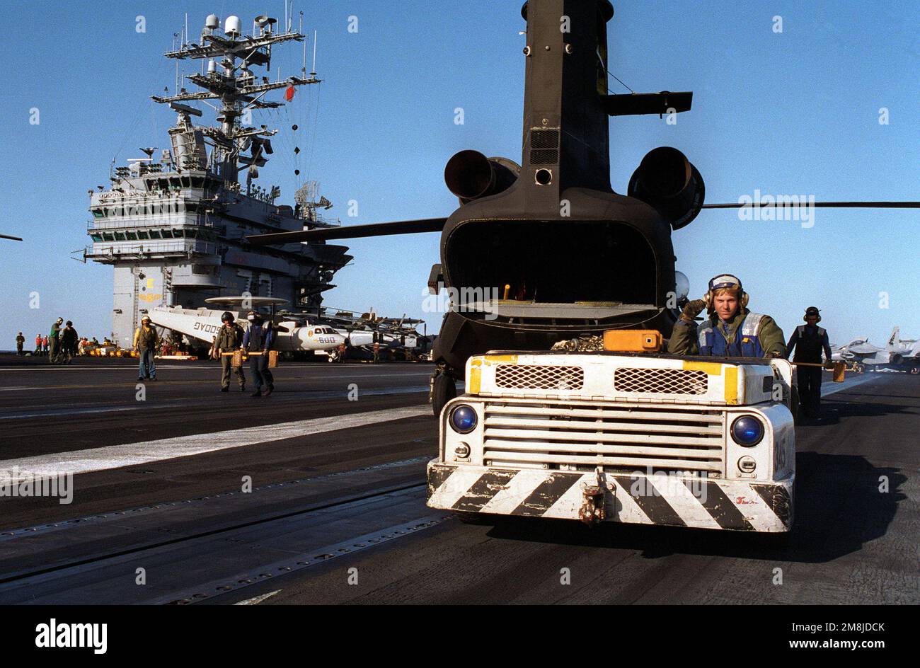 An MD-3A tow tractor is used to pull a U.S. Army MH-47D Chinook medium ...