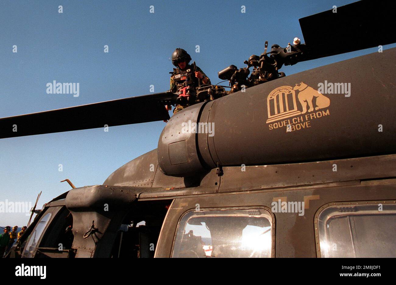 A crewmember of a U.S. Army MH-60 Black Hawk (Blackhawk) command and ...