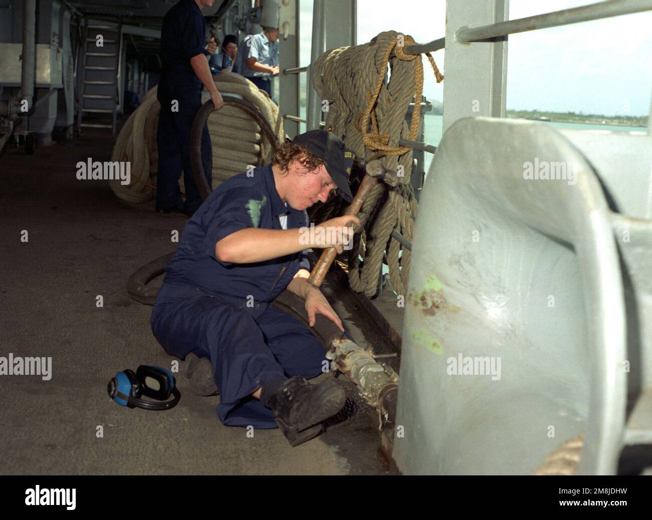 Engineman Fireman Apprentice (ENFA) Michelle L. Smith disconnects the ...