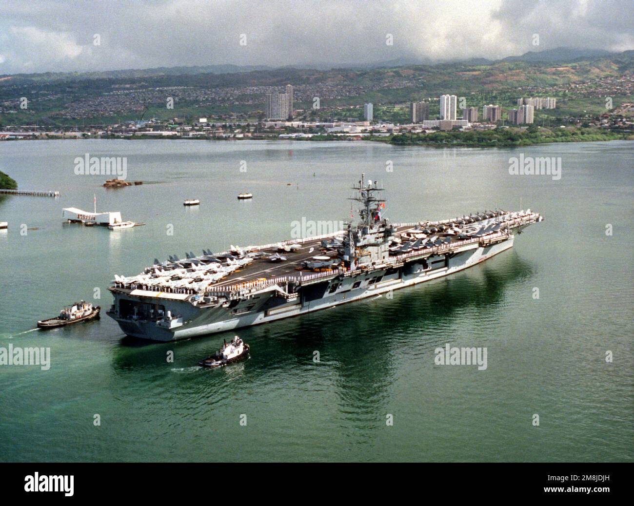 A starboard quarter view of the nuclear-powered aircraft carrier USS ...