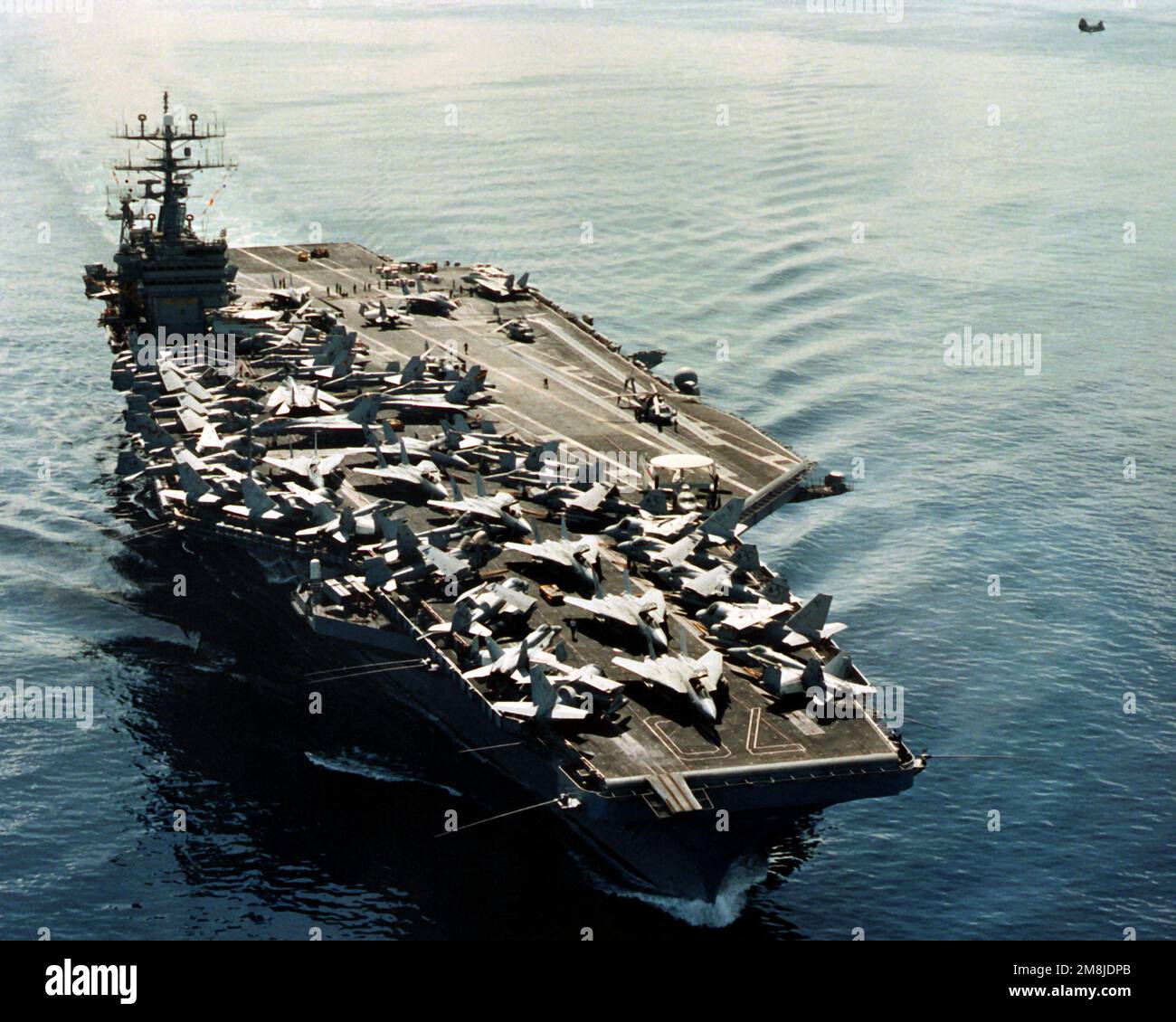 A starboard bow view of the nuclear-powered aircraft carrier USS CARL ...