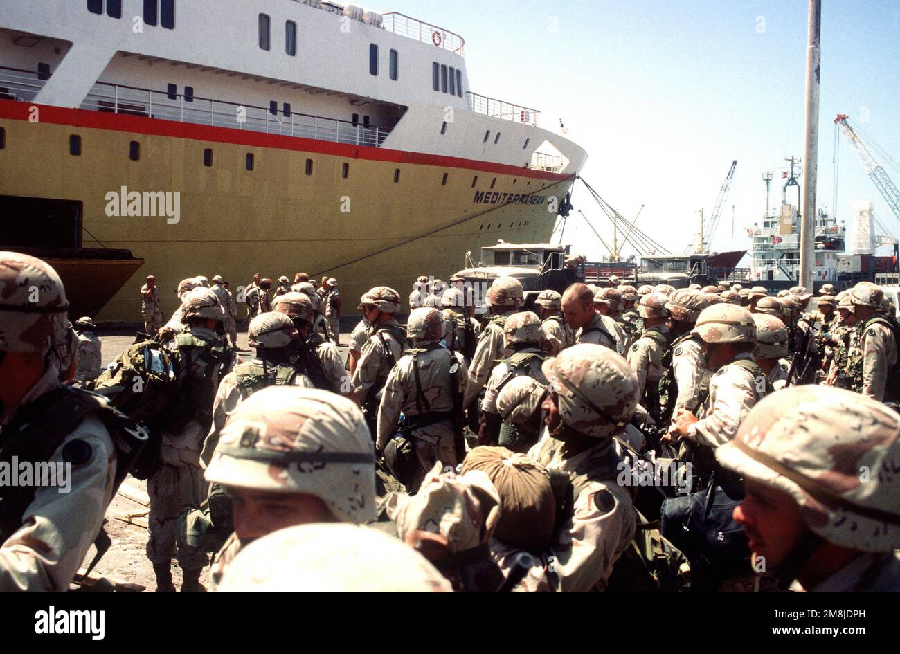 U.S. Army soldiers wait at Mogadishu seaport to board the Military ...