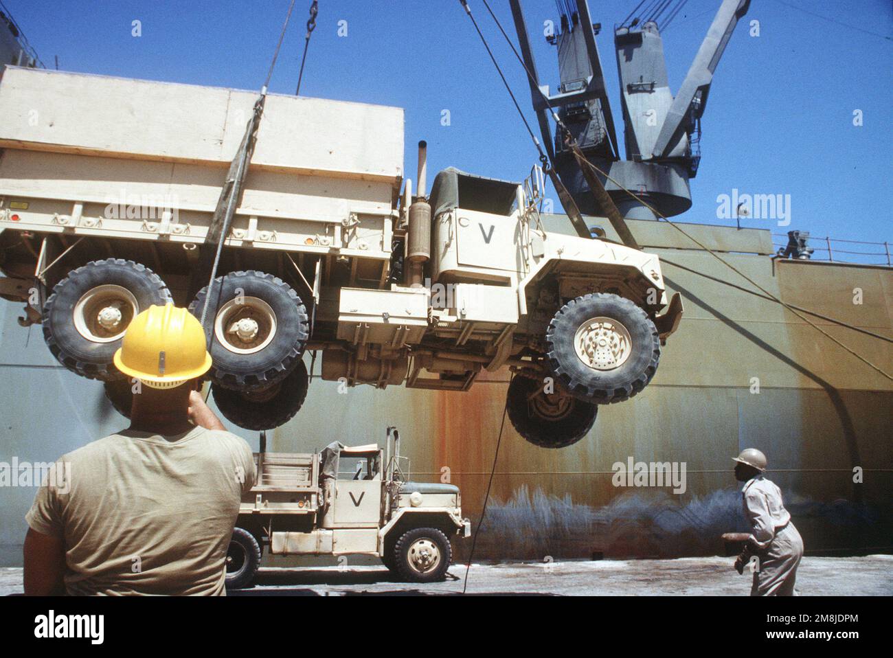 The 155th Transportation Company, Fort Eustis, VA, load an M9A9 5-ton ...