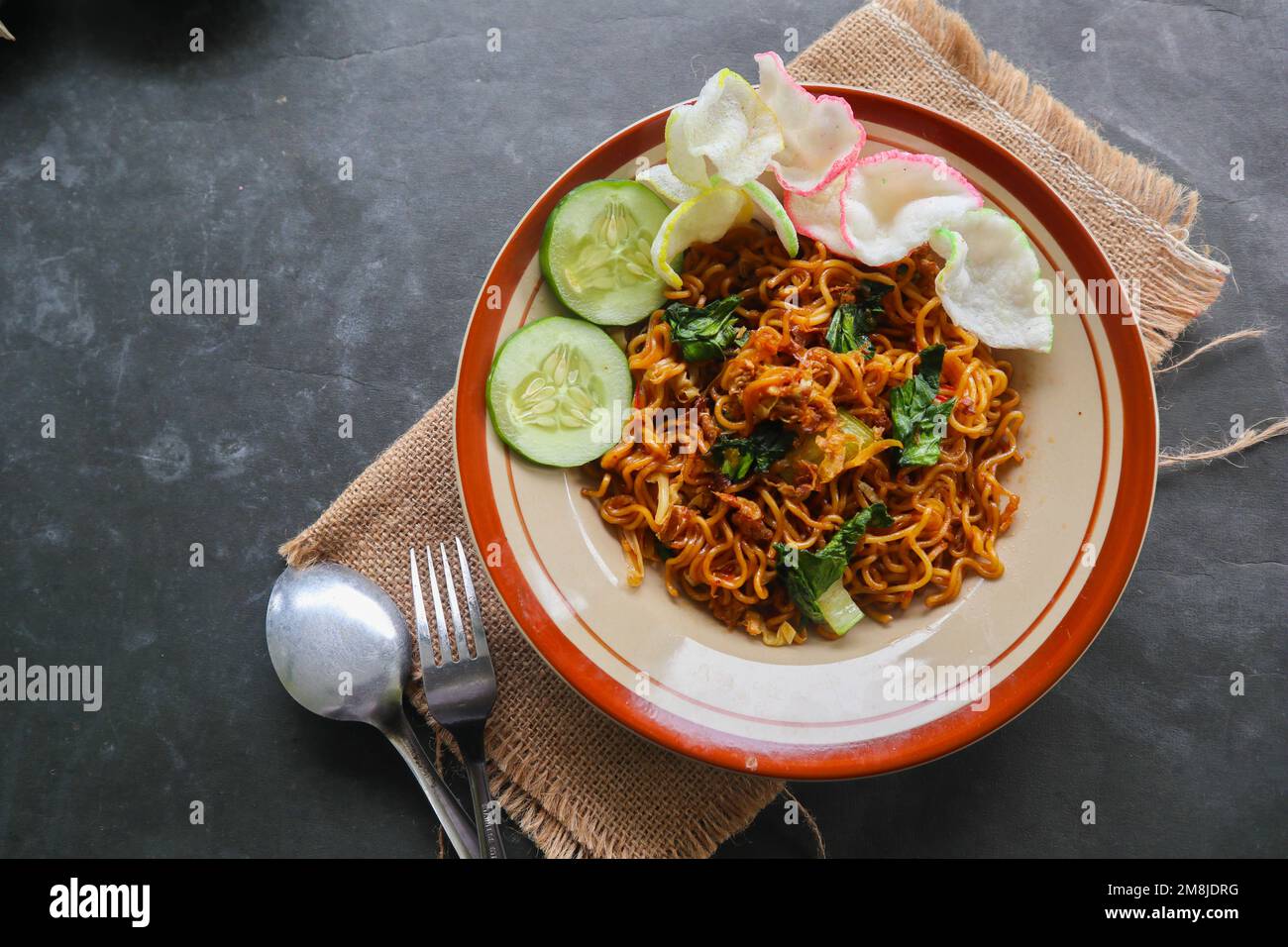 mie tek tek or fried noodle made with egg noodles with chicken, cabbage ...