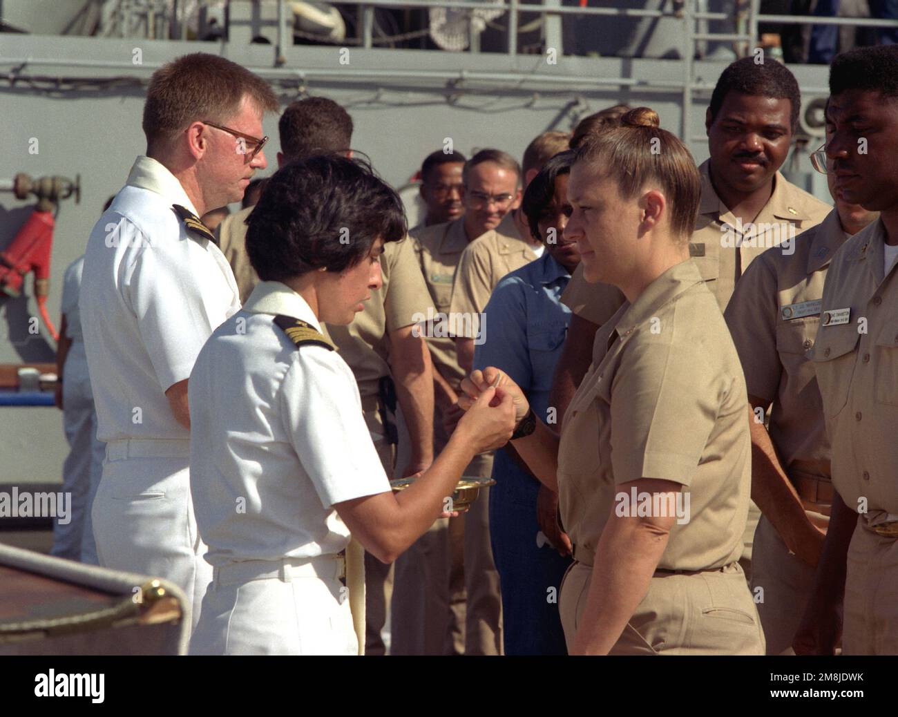CHIEF Hospital Corpsman (HMC) Frances Rose receives communion from CDR ...