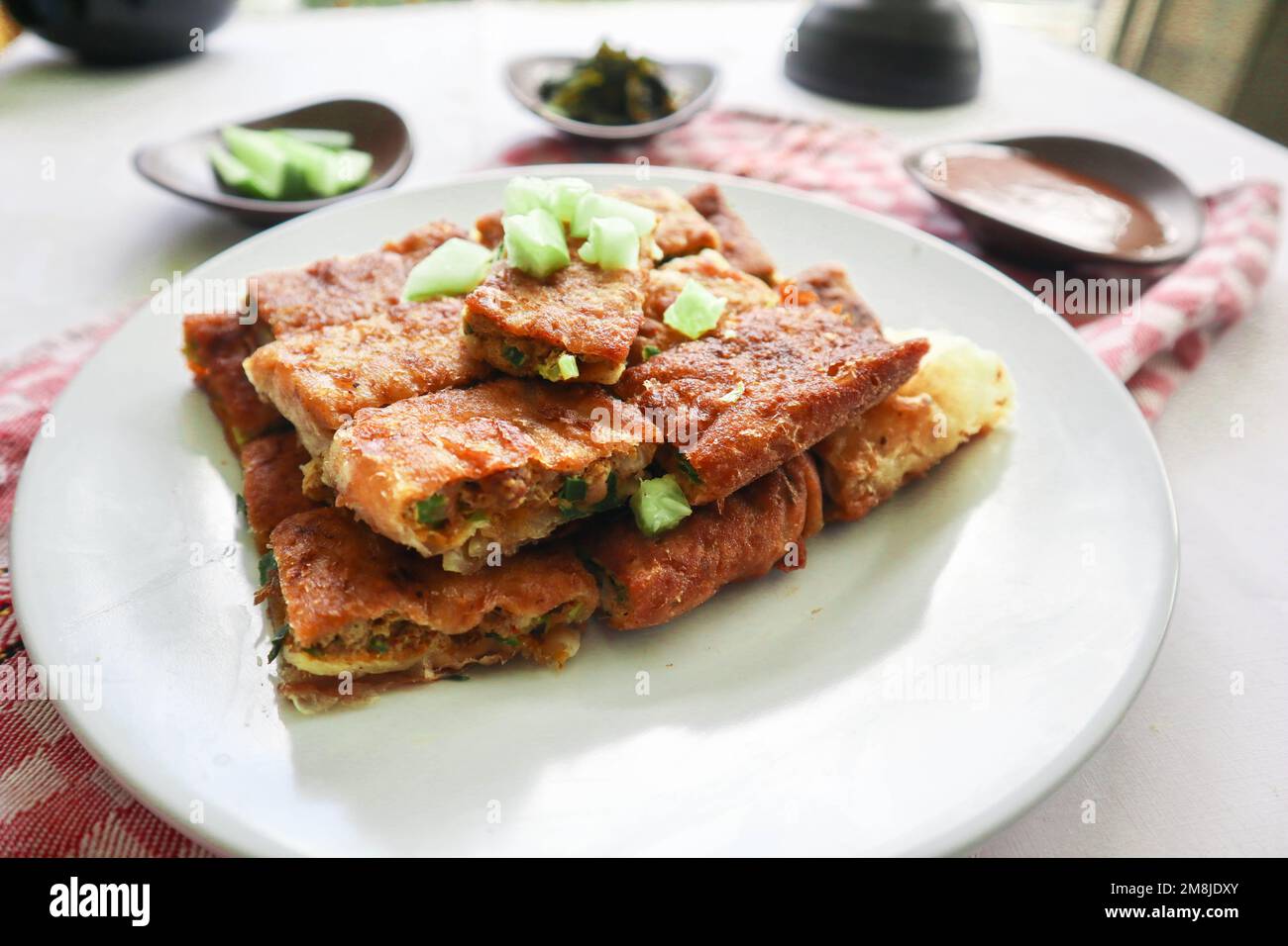 Martabak Telor or Murtabak Telur or mutabbaq. Savory pan-fried pastry ...