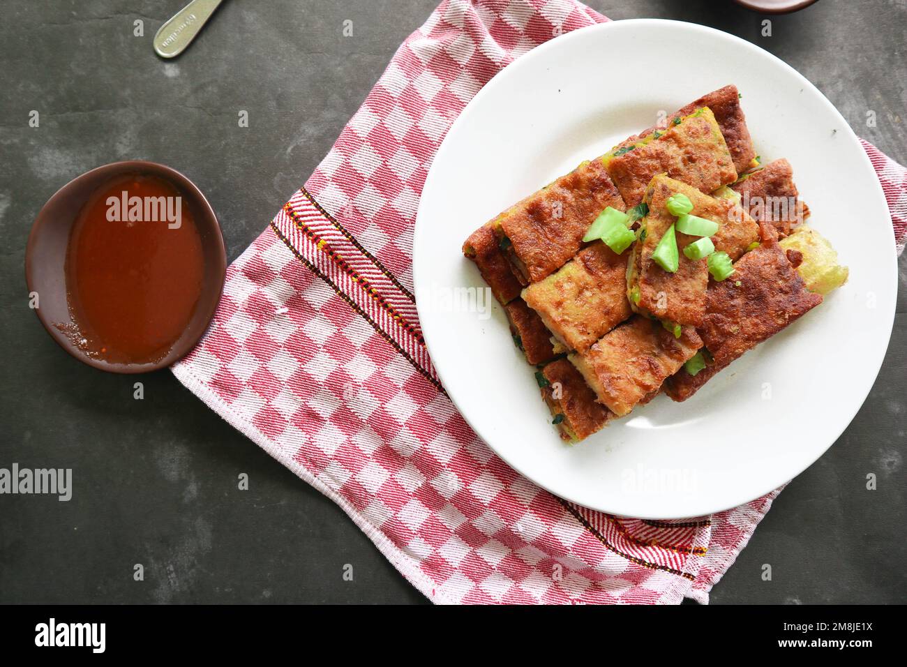 Martabak Telor or Murtabak Telur or mutabbaq. Savory pan-fried pastry ...