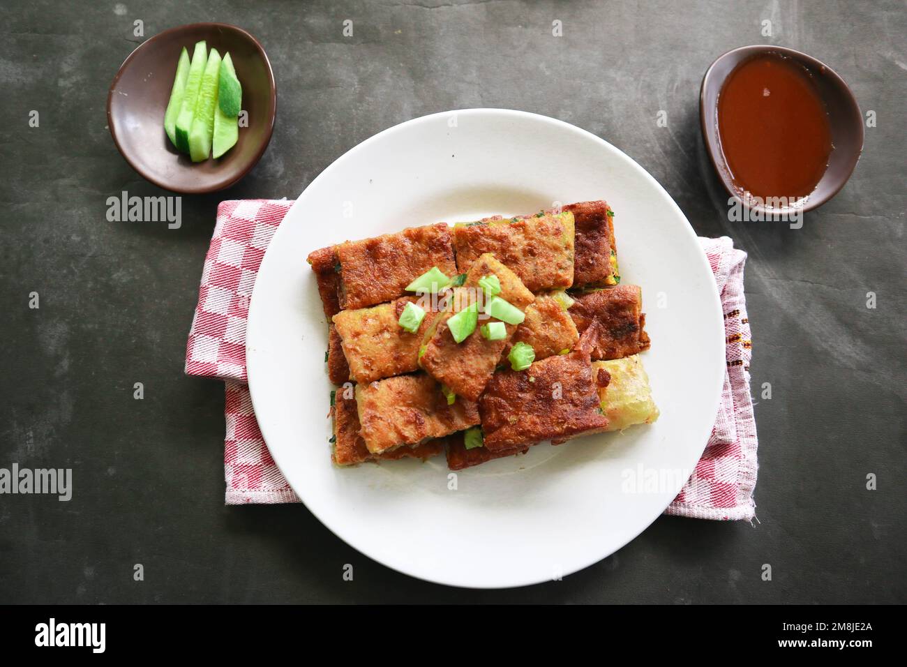 Martabak Telor or Murtabak Telur or mutabbaq. Savory pan-fried pastry ...