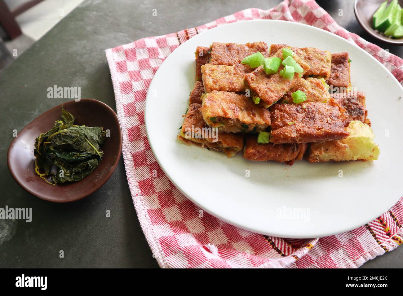 Martabak Telor or Murtabak Telur or mutabbaq. Savory pan-fried pastry ...