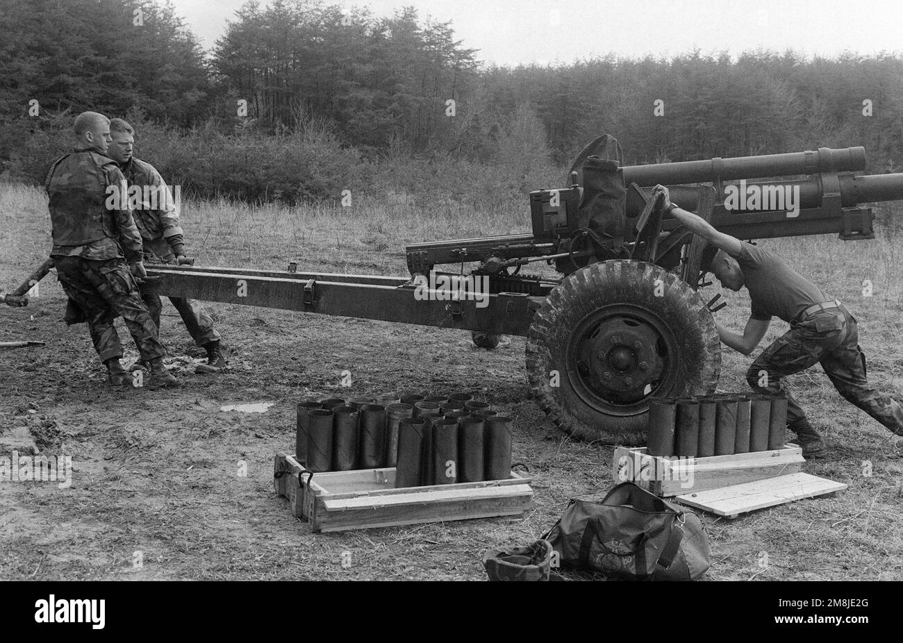 A Marine artillery crew moves an M114 155 Howitzer carriage into a new ...