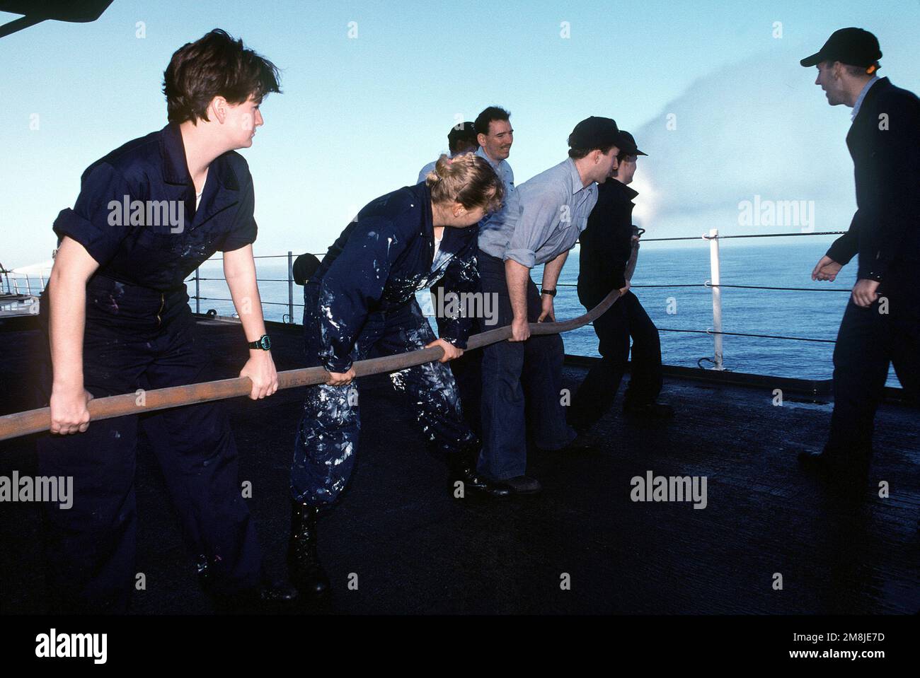 New crewmember SEAMAN (SN) Stormi Frusetta (left) receives some hands ...