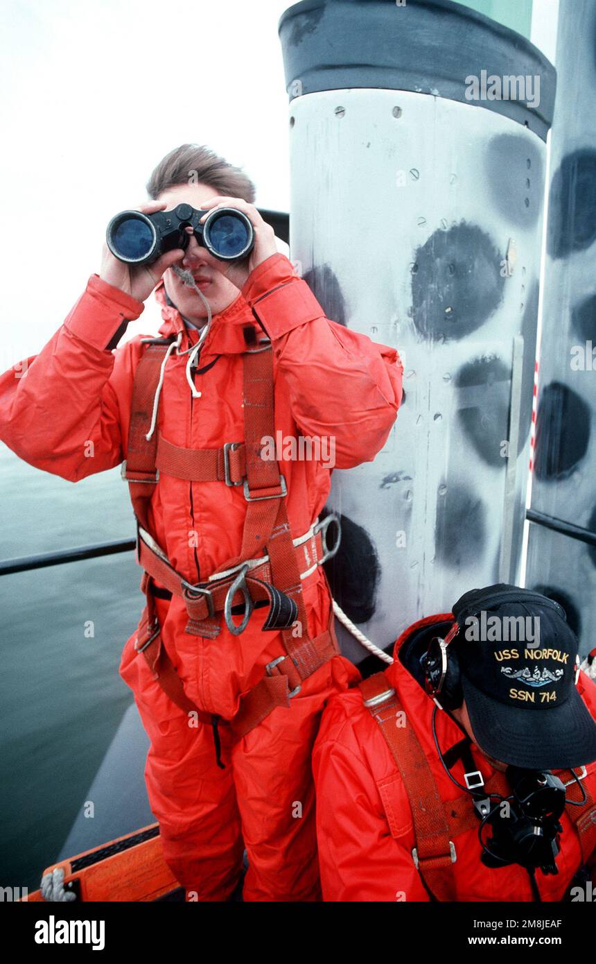 A maneuvering crew of the nuclear-powered attack submarine USS NORFOLK ...