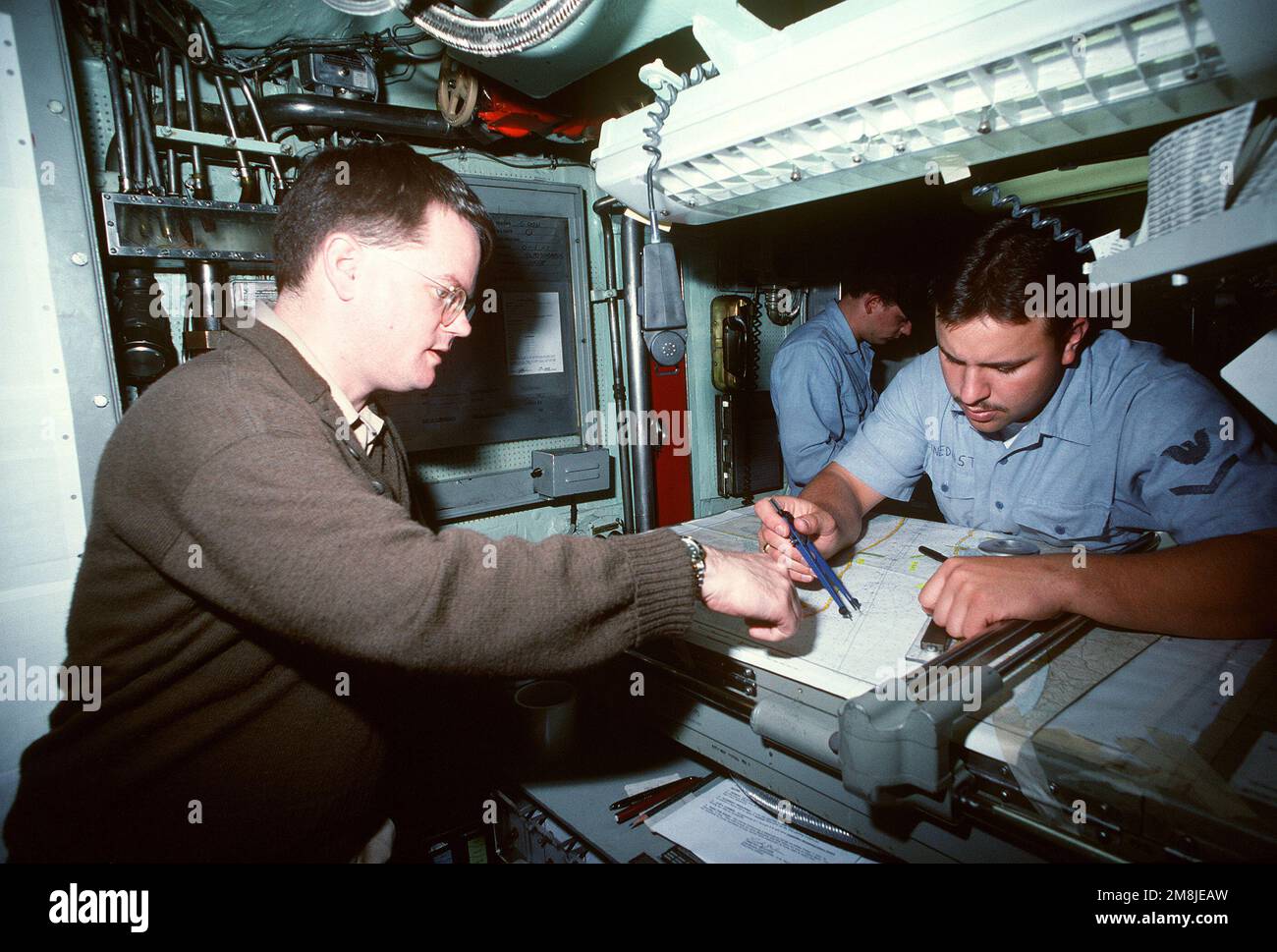 LCDR Jon Maclaren and Quartermaster Third Class (QM3) Winston ...