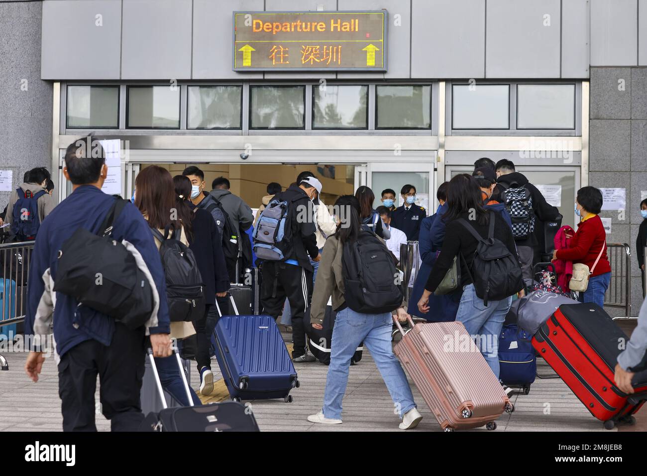 Travelers in the border control area at Shenzhen Bay, on the first day ...