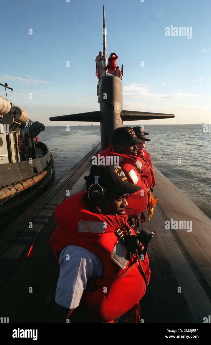 Crewmembers of the deck force of the nuclear-powered attack submarine ...