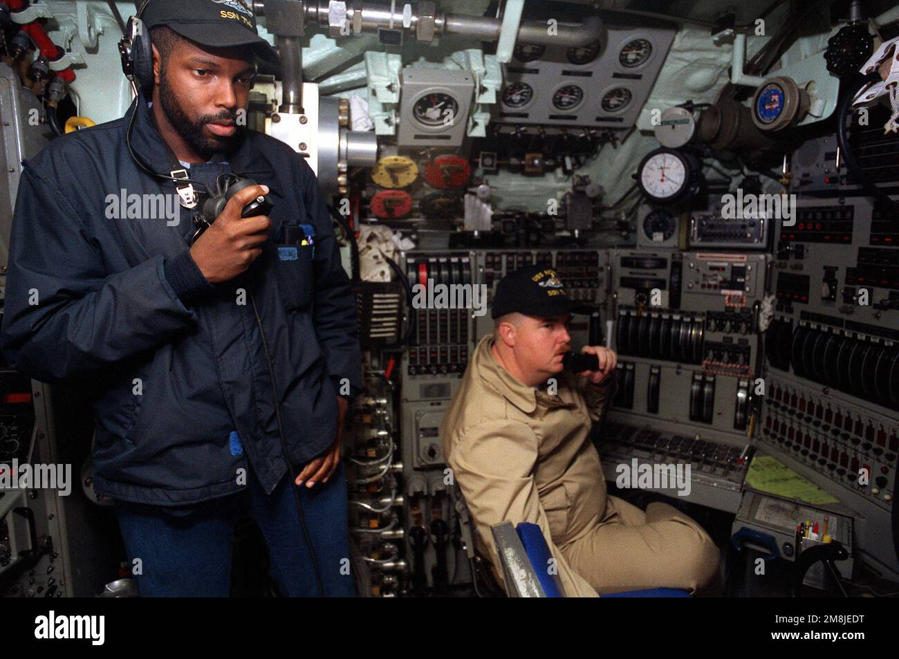 SENIOR CHIEF Torpedoman (TMCS) Jeffery Leonard mans the communication ...