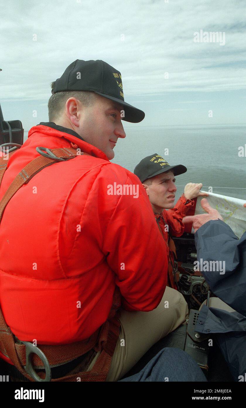 LCDR Tim Mulcare (left) and LTJG Drew Rainer talk with the civilian ...