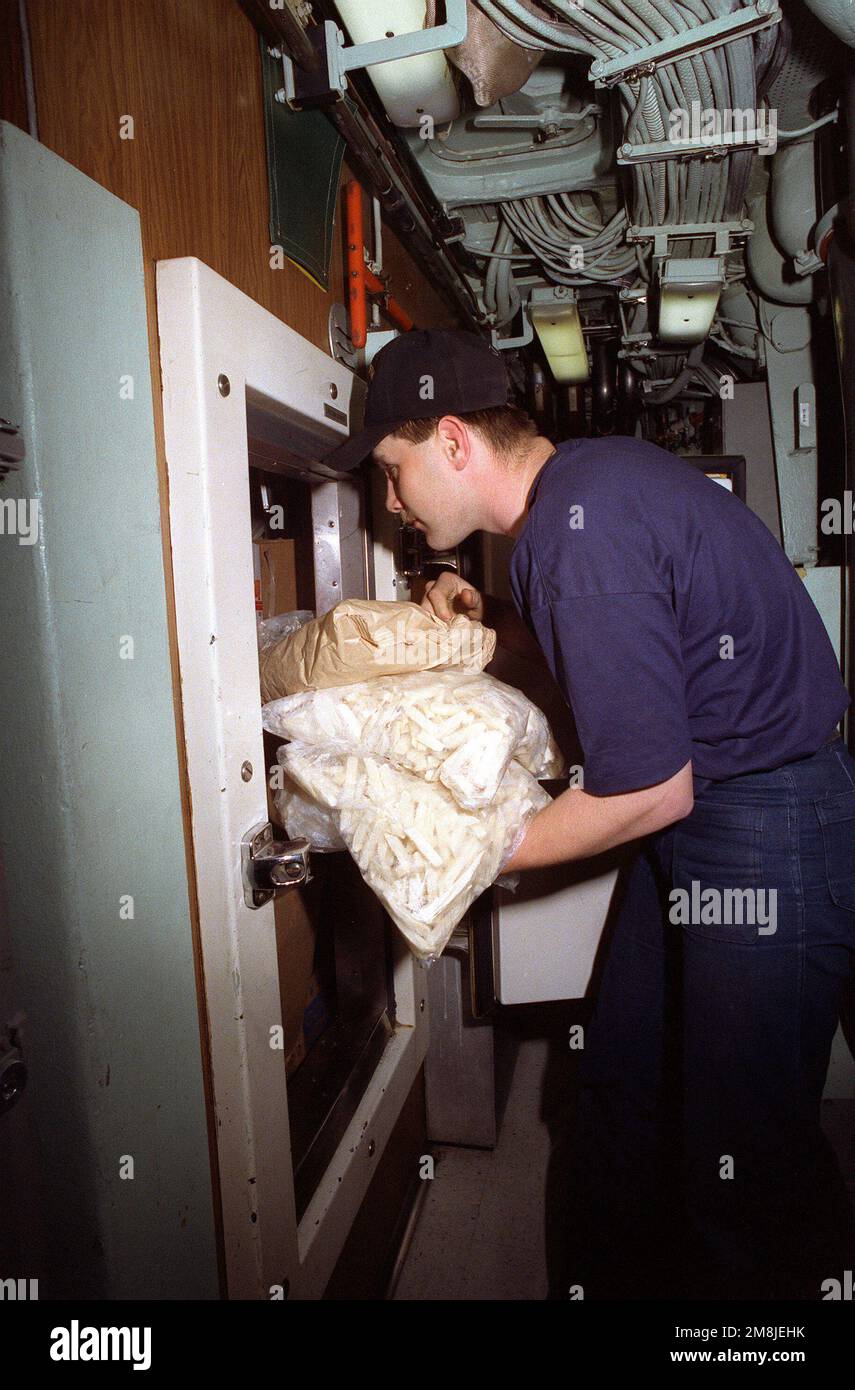 Mess SPECIALIST Third Class (MS3) James Frame is shown breaking out ...