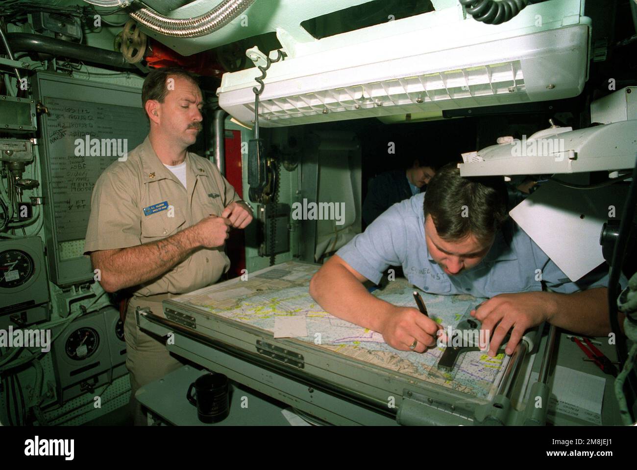 SENIOR CHIEF Quartermaster (QMCS) Greg Solberg reviews the course being ...