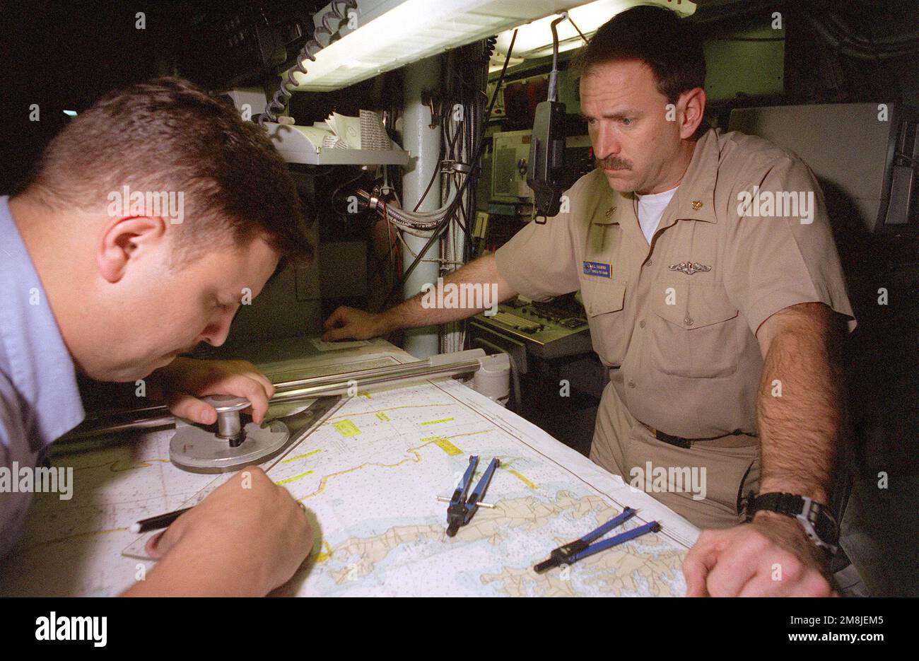 SENIOR CHIEF Quartermaster (QMCS) Greg Solberg reviews the course being ...