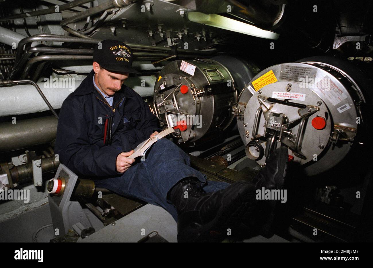 Radioman First Class (RM1) David Schempp enjoys a moment of solitude ...