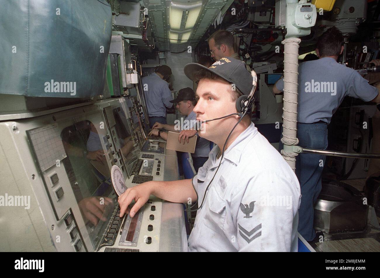 Fire Control Technician Second Class (FT2) Matthew Beaker stands watch ...