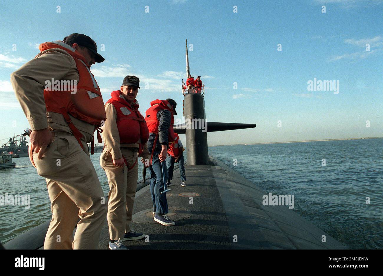 Members of the deck force of the nuclear-powered attack submarine USS ...