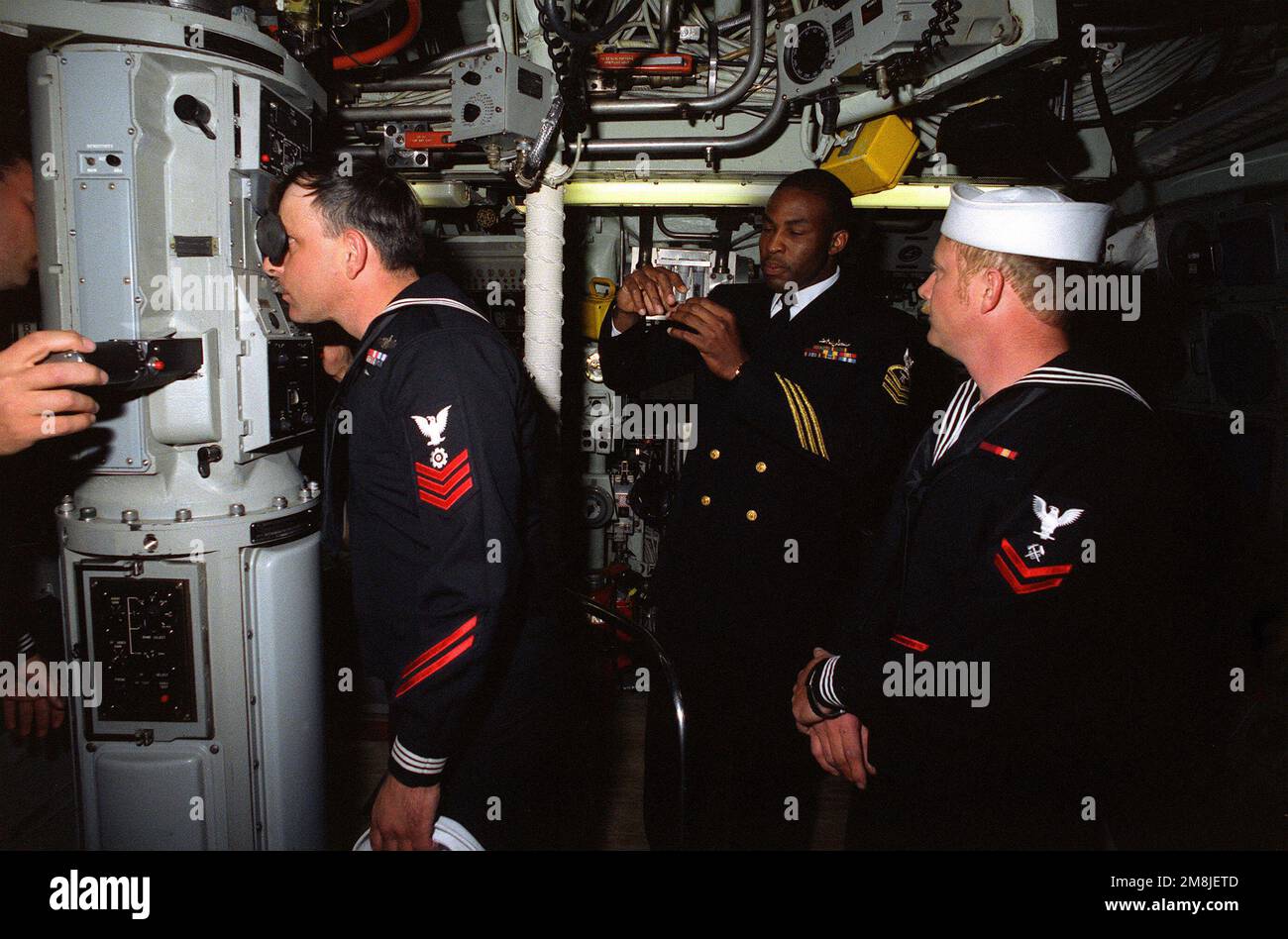 Crewmembers of the submarine tender USS FRANK CABLE (AS-40) enjoy a ...