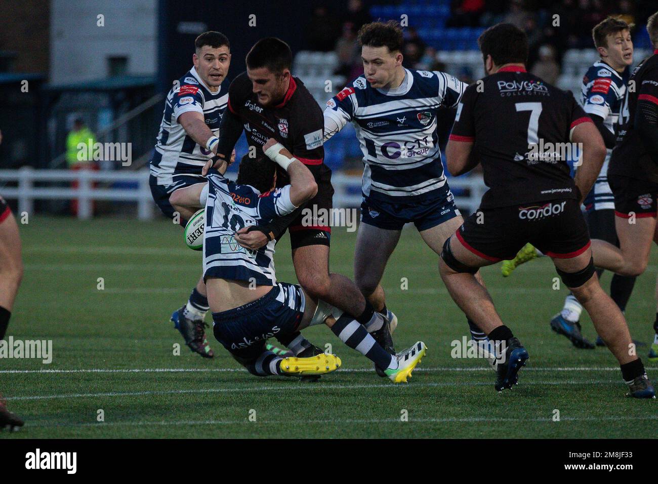 Coventry, UK. 14th Jan, 2023. *** Jordan Holgate of Jersey tackles ...