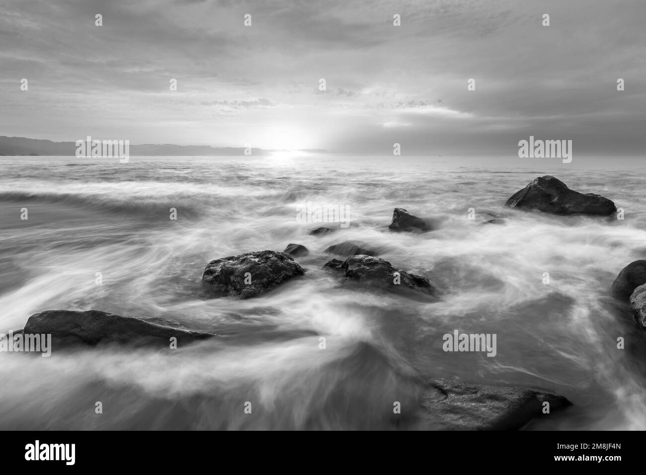 Misty Water Flowing Over Ocean Rocks Black And White Stock Photo - Alamy