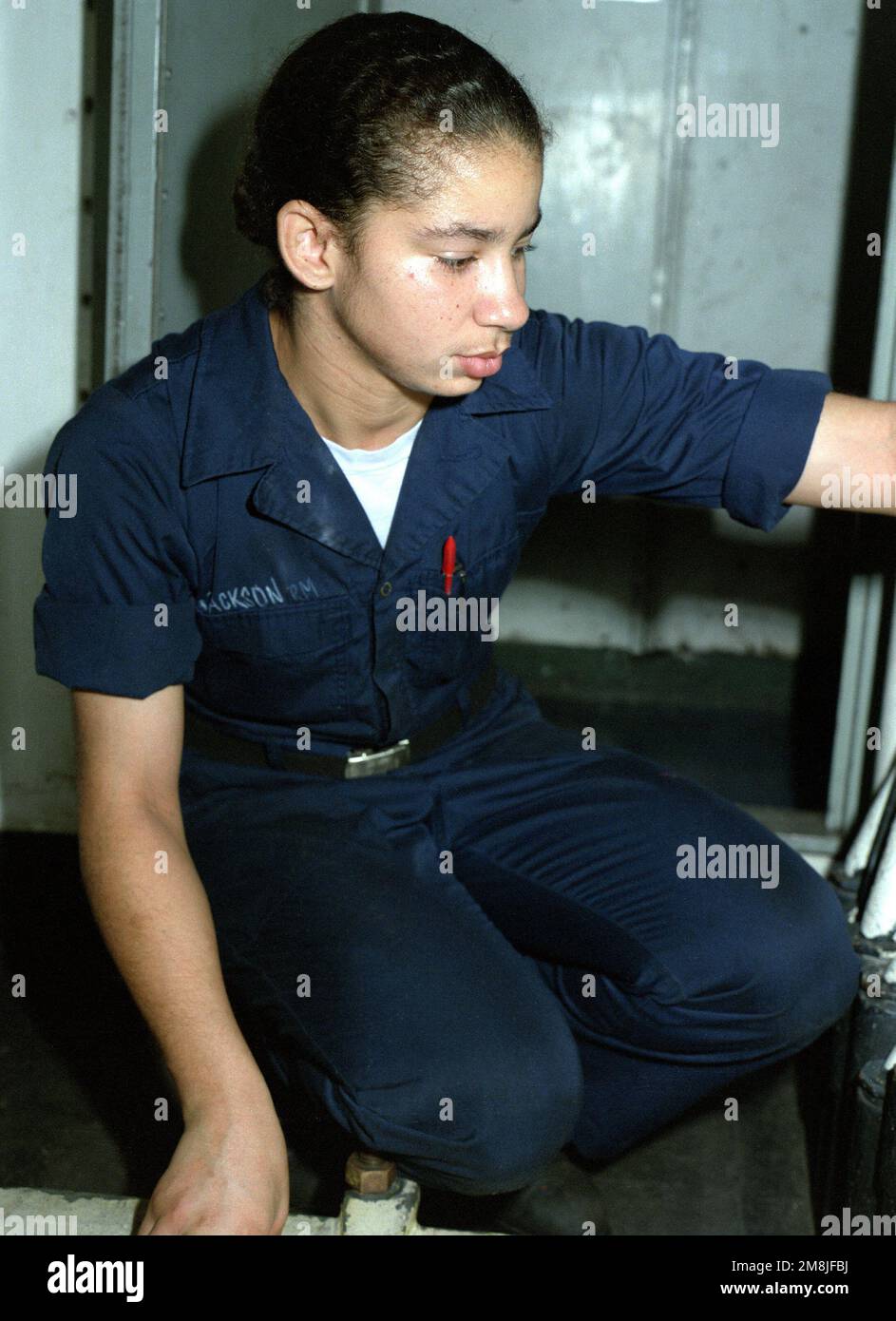 Engineman Third Class (EN3) Robin Jackson dogs down hatches to secure ...