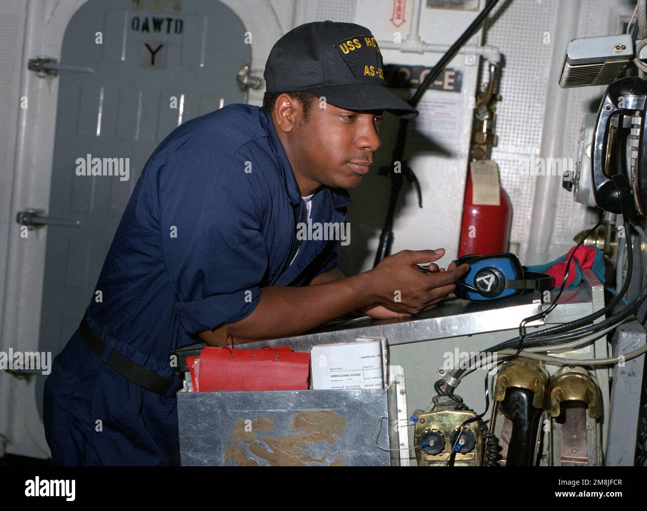 Engineman Fireman (ENFN) Eric Ellis stands a high-pressure air ...