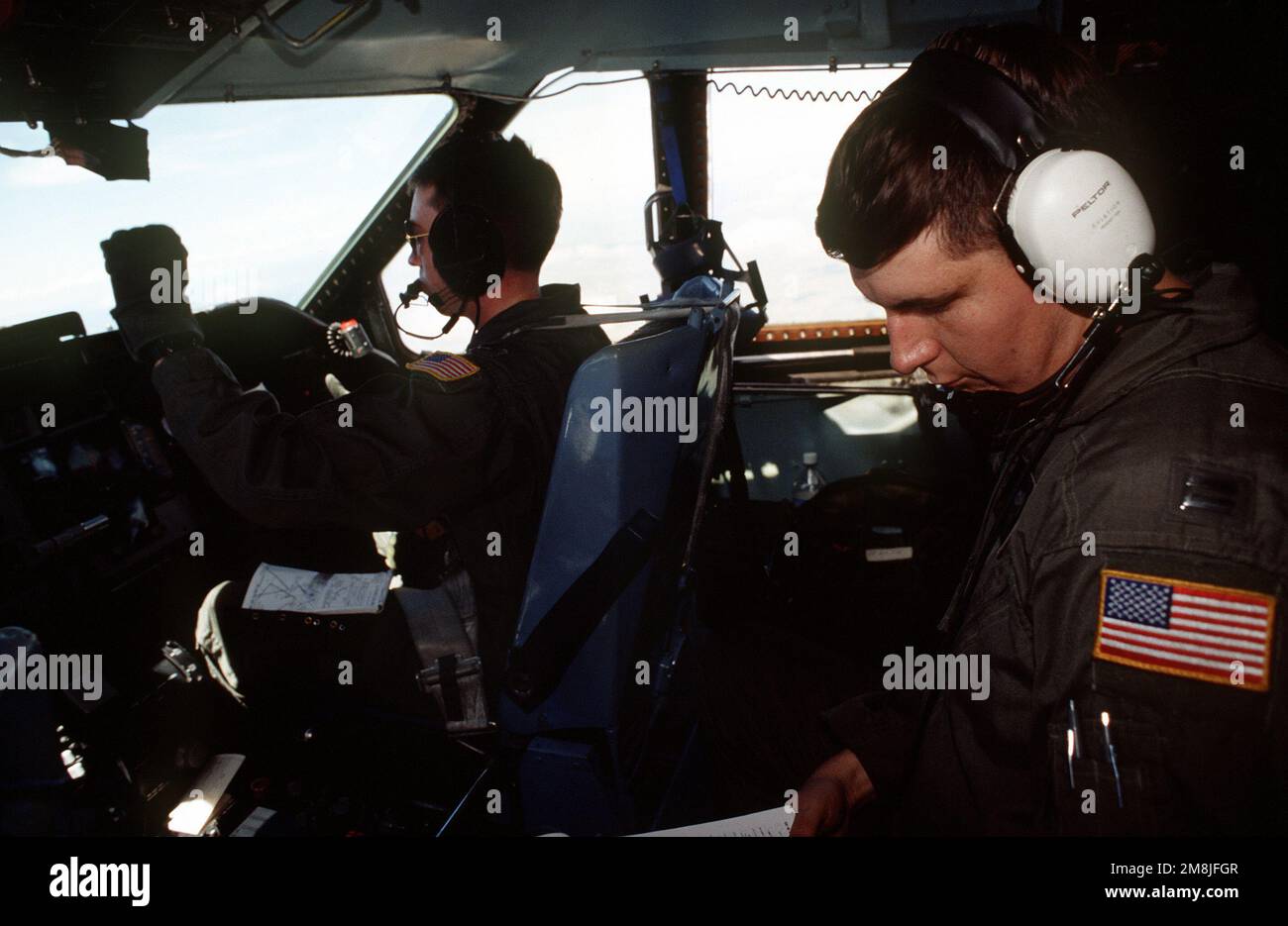 Interior view of cockpit as LT. Lance Devin, co-pilots the C-141B, from the 438th Airlift Wing ...