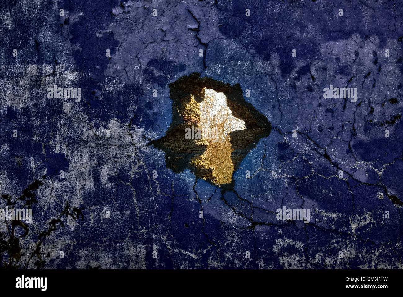 An abandoned house in the East. The wall is broken and a neglected ...