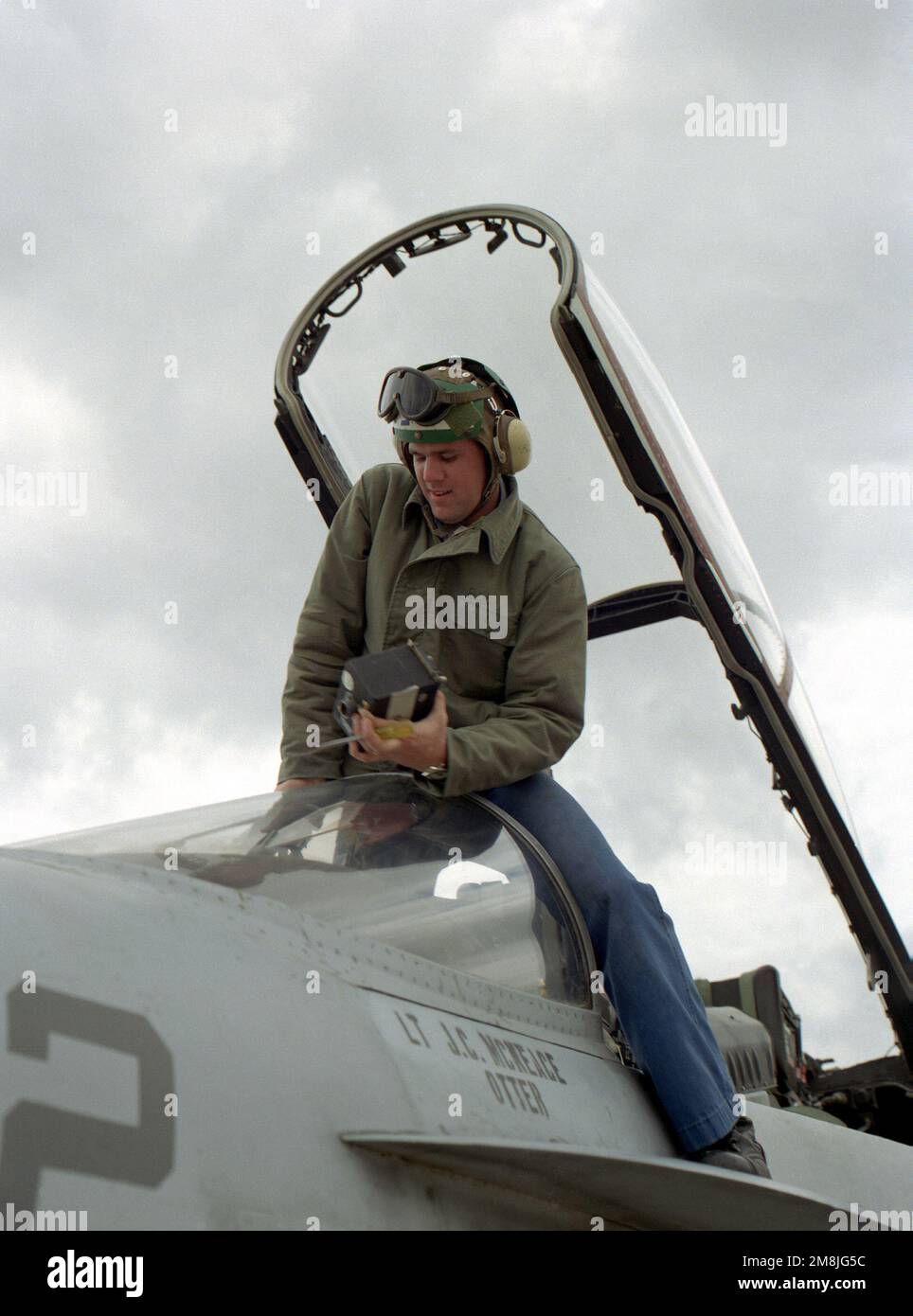AIRMAN Brian Yokley trouble shoots the heat probe in the cockpit of an ...
