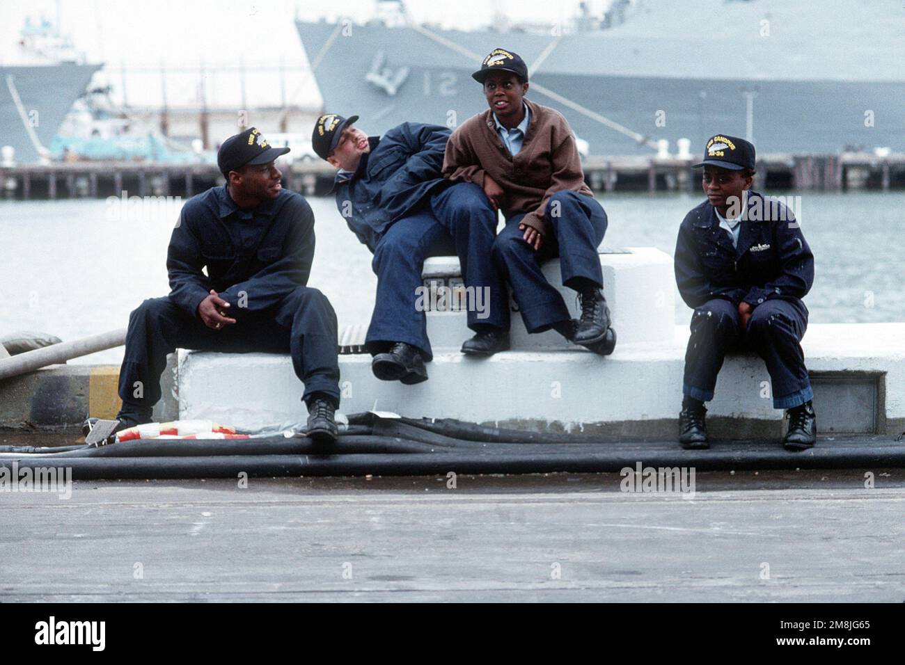 Four shipmates from the submarine tender USS CANOPUS (AS-34) enjoy each ...