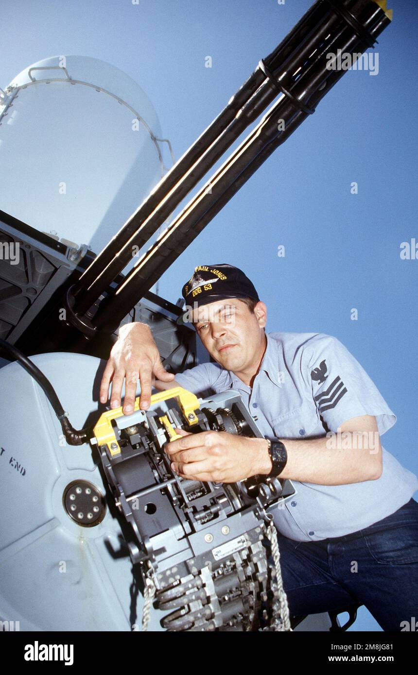 Fire Control Technician First Class (FC1) Jim Begalla performs ...