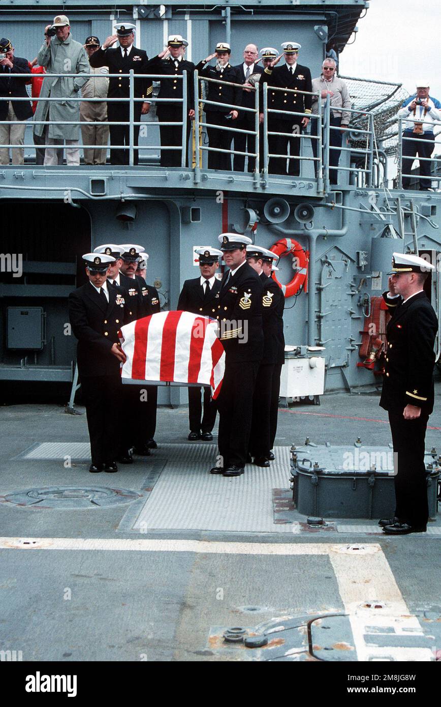 Six members of the USS NORMANDY (CG-60) chief's mess carry the flag ...