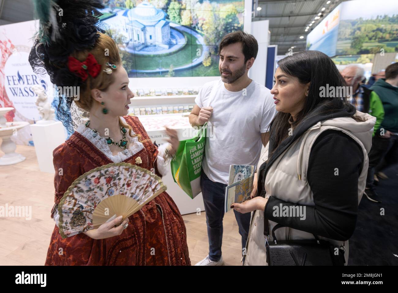 Stuttgart, Germany. 14th Jan, 2023. A woman in disguise advises a ...