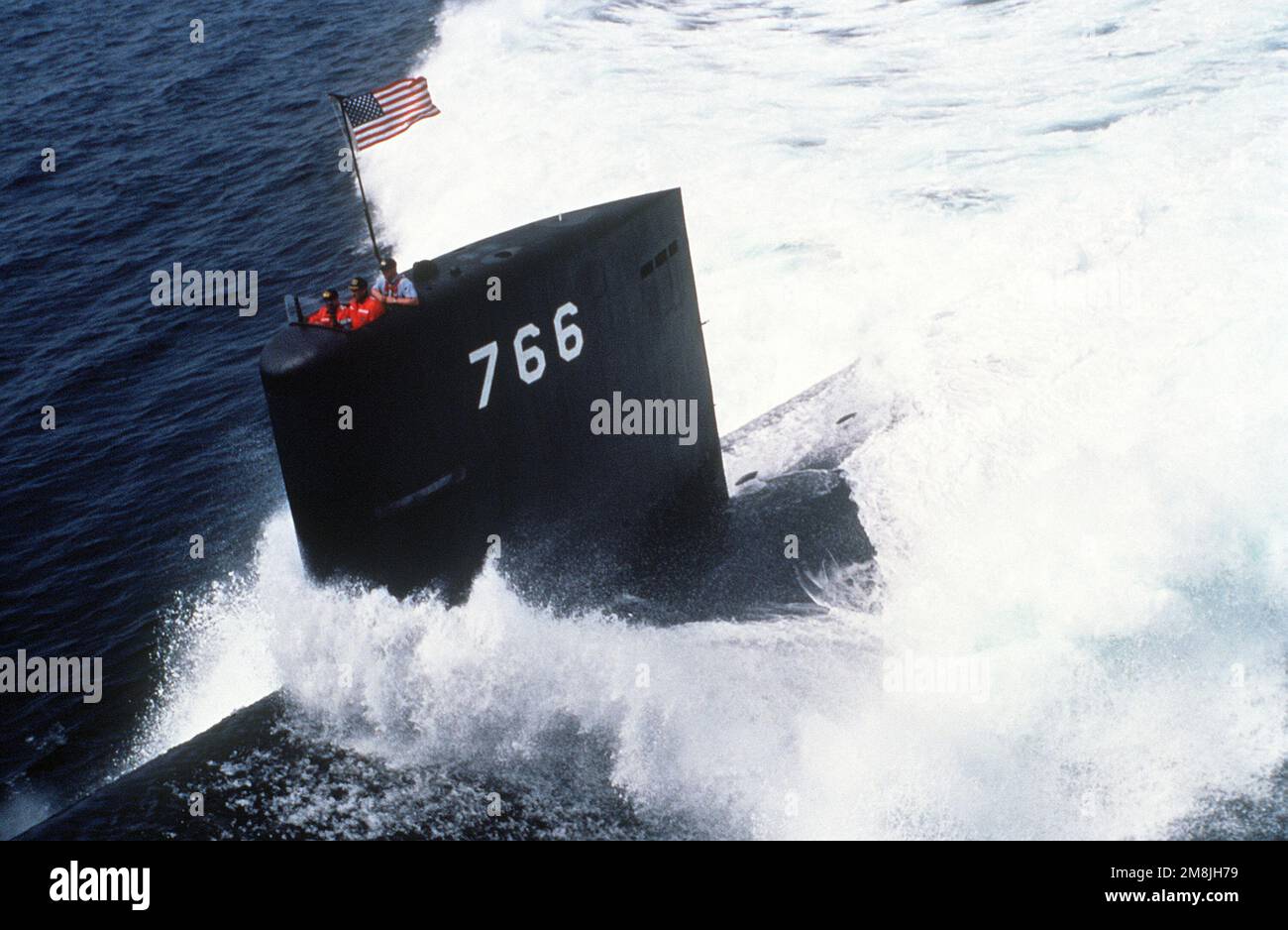 An aerial port side view of the nuclear-powered attack submarine USS ...