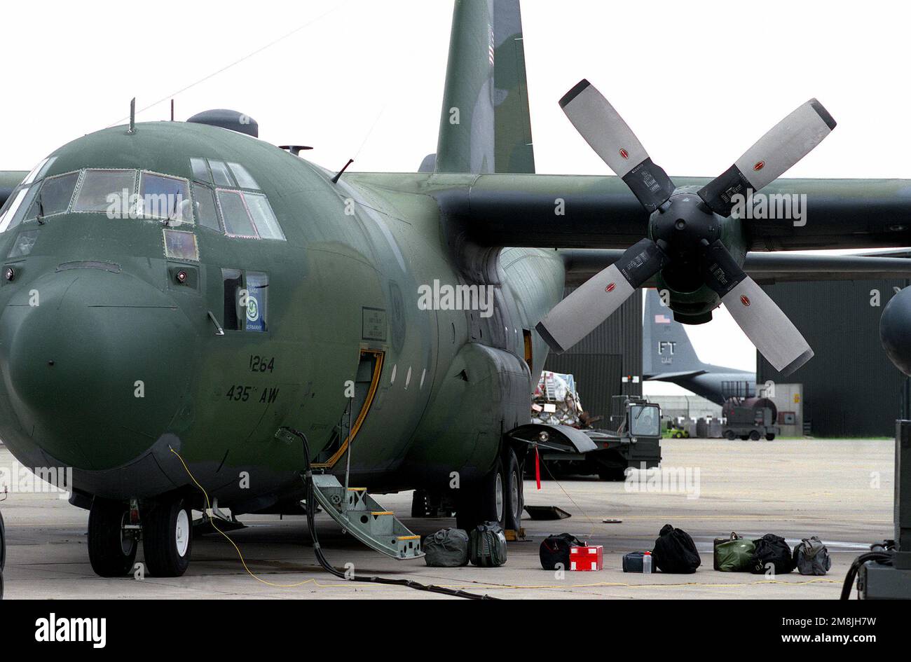 A C-130 is being loaded with equipment and personal belongings of the ...