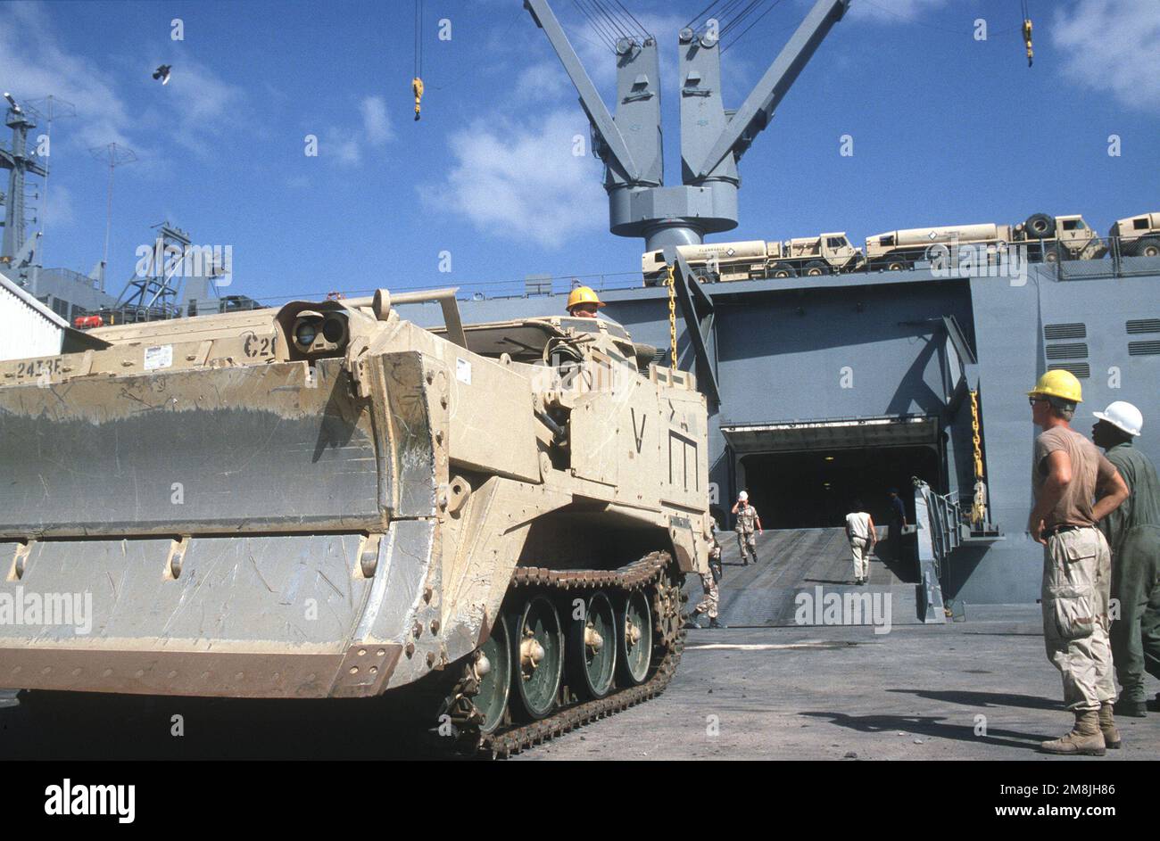 The 155th Transportation Company, Fort Eustis, VA, guides a bulldozer ...
