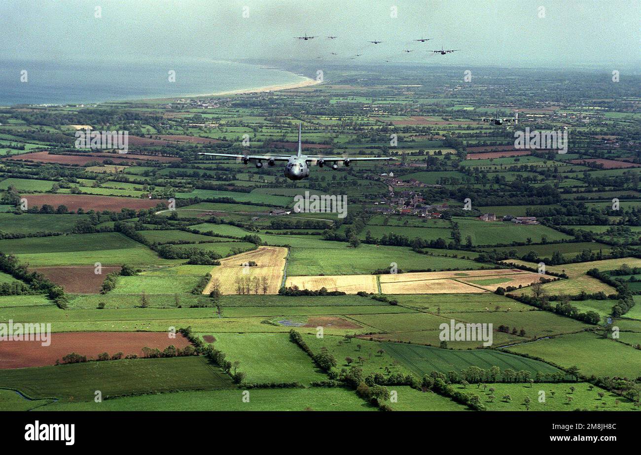Three Squadrons are pictured in the background flying over the Normandy ...